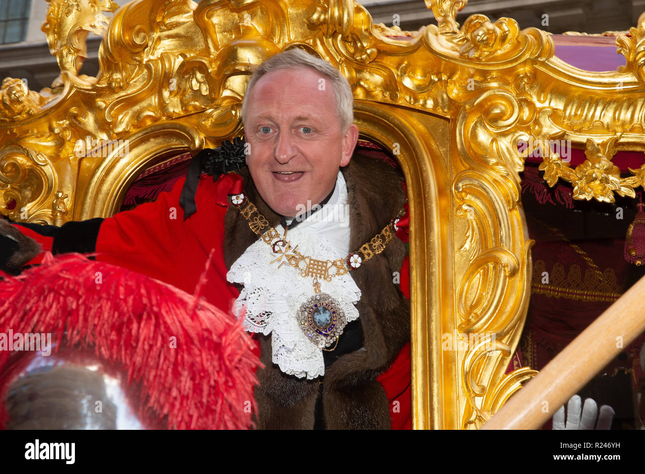 The New Lord Mayor, Peter Estlin, leans out of the Gold coach and waves ...