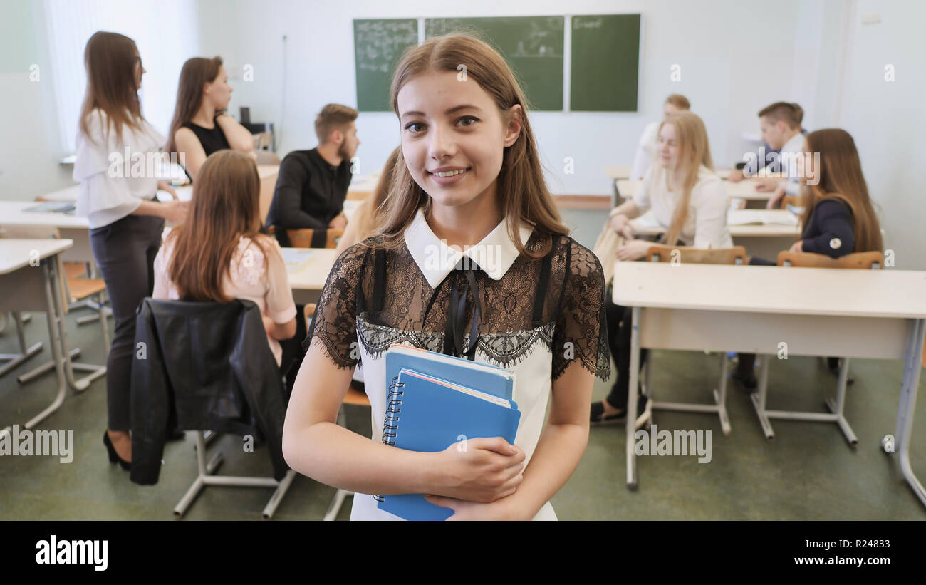 Portrait of a young Russian high school graduate against the background ...