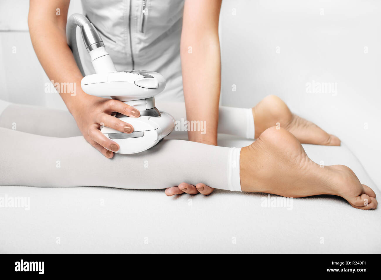 woman receiving lpg massage against cellulite on her leg Stock Photo ...