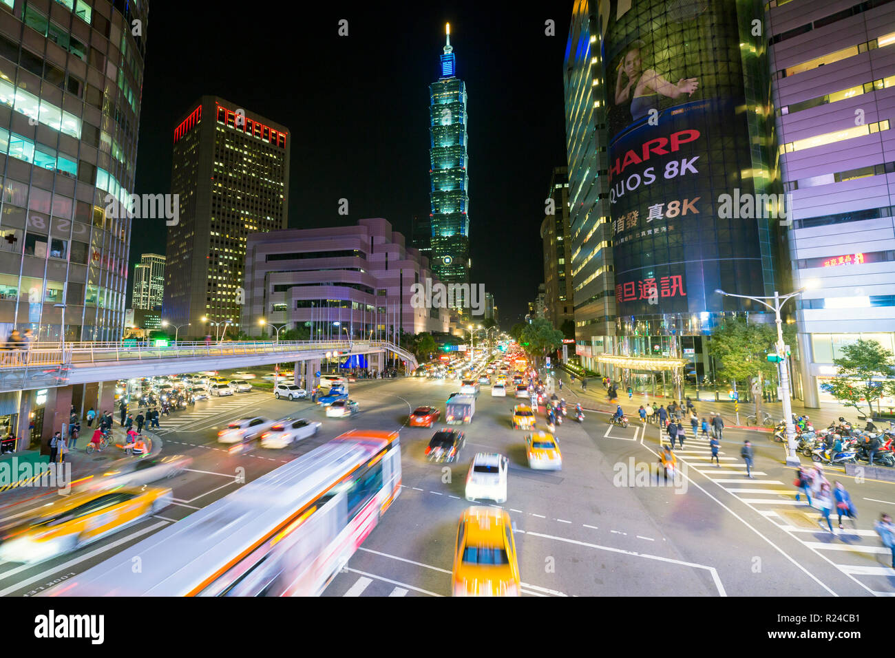 Traffic in front of Taipei 101 at a busy downtown intersection in the ...