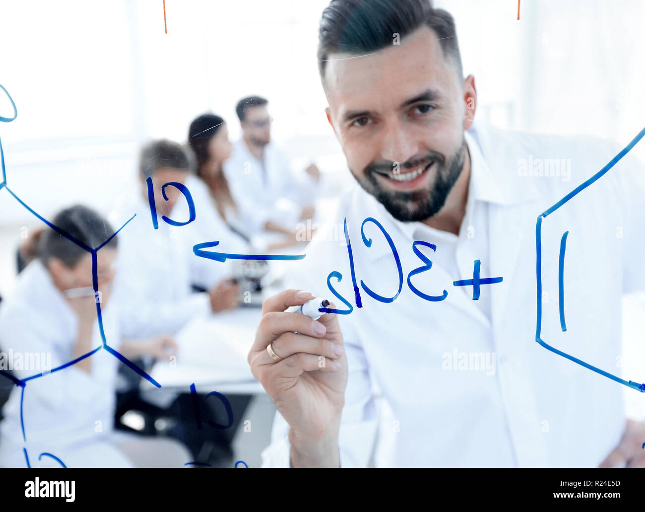 closeup of a serious scientist working with formulas Stock Photo - Alamy