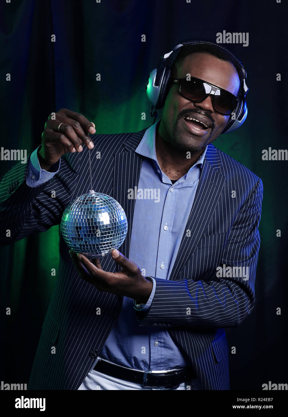 African American man Disco Ball Over Black Background Stock Photo - Alamy