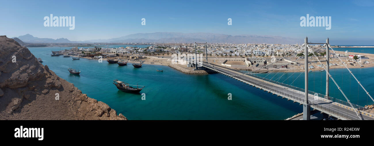 Al Ayjah Bridge in Sur, Oman. The bay is dotted with traditional wooden ...