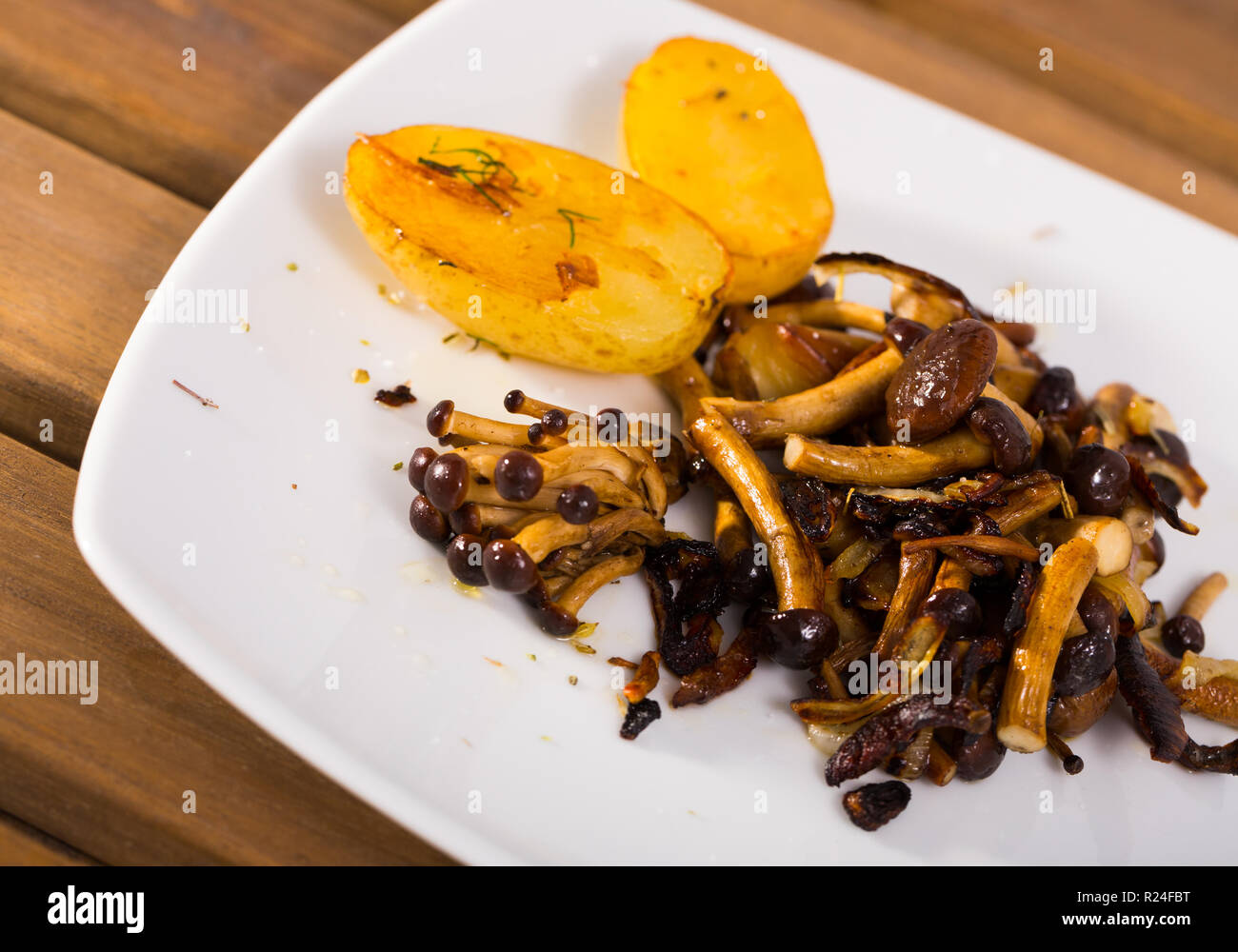 Delicious cooked fried honey fungus mushrooms with young potatoes at ...