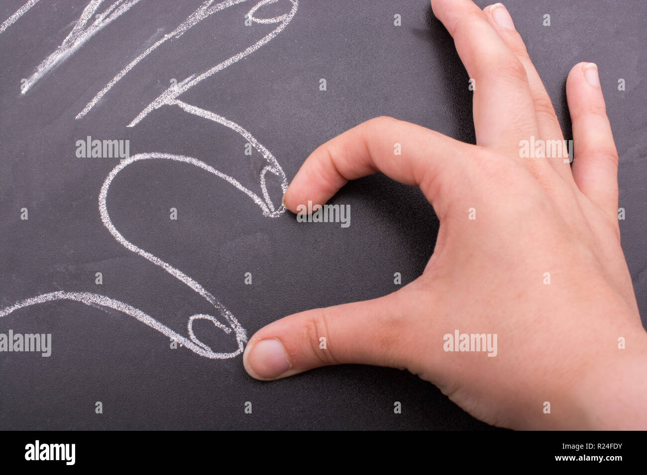 Hands forming a heart on a blackboard Stock Photo - Alamy