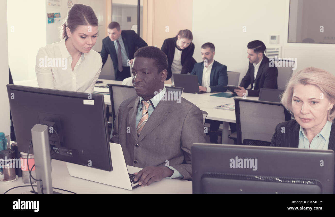 Business associates engaged in hi-res stock photography and images - Alamy