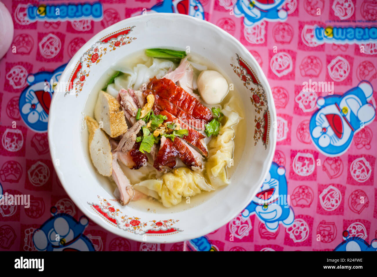 Fresh prepared asian aromatic duck broth soup with dimsum dumplings ...