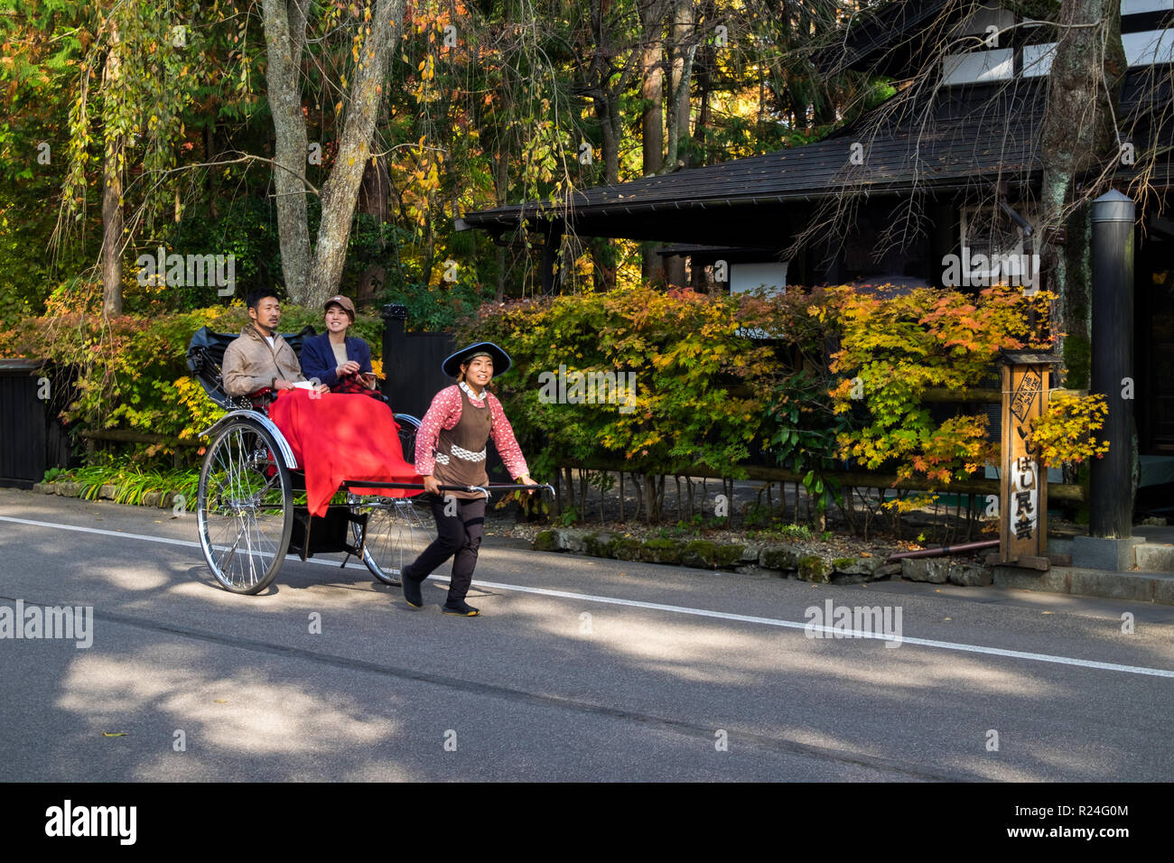 A rickshaw along Bukeyashiki street in Kakunodate, Japan during the ...