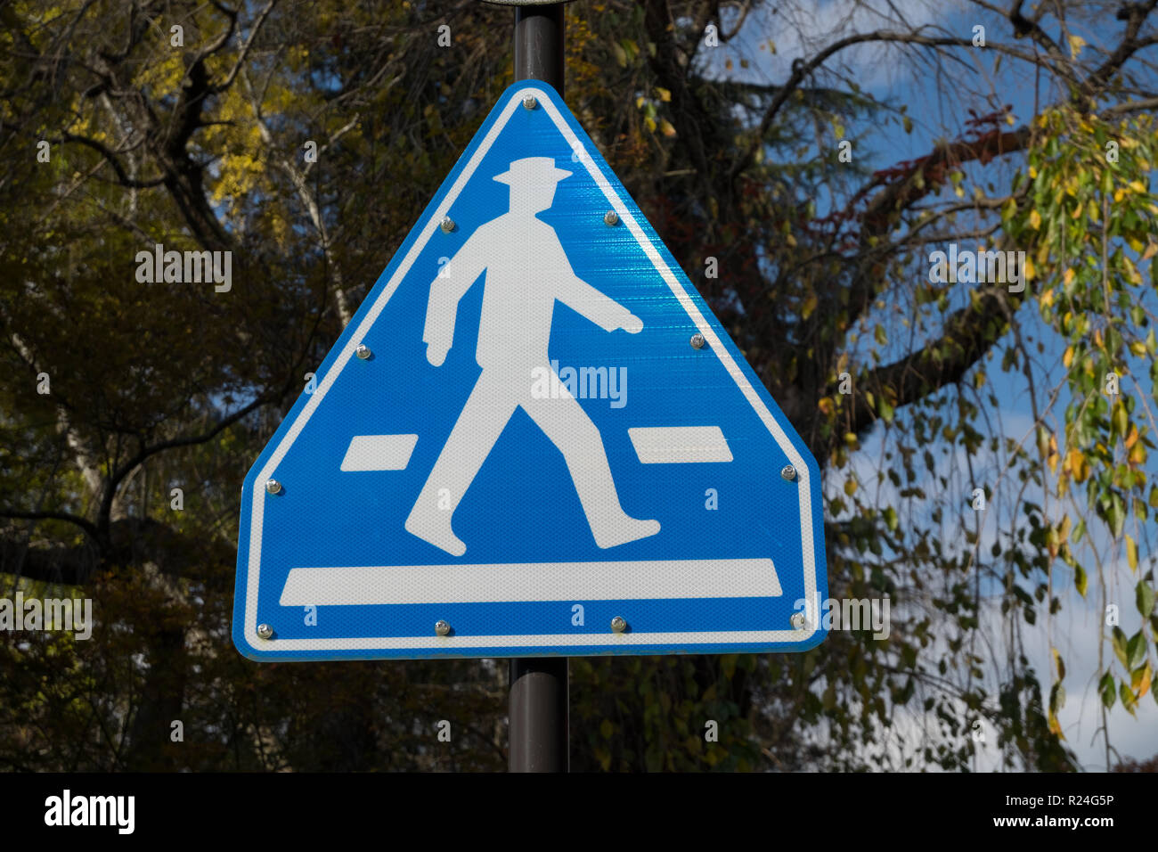 A blue street crossing sign in Kakunodate, Japan Stock Photo - Alamy