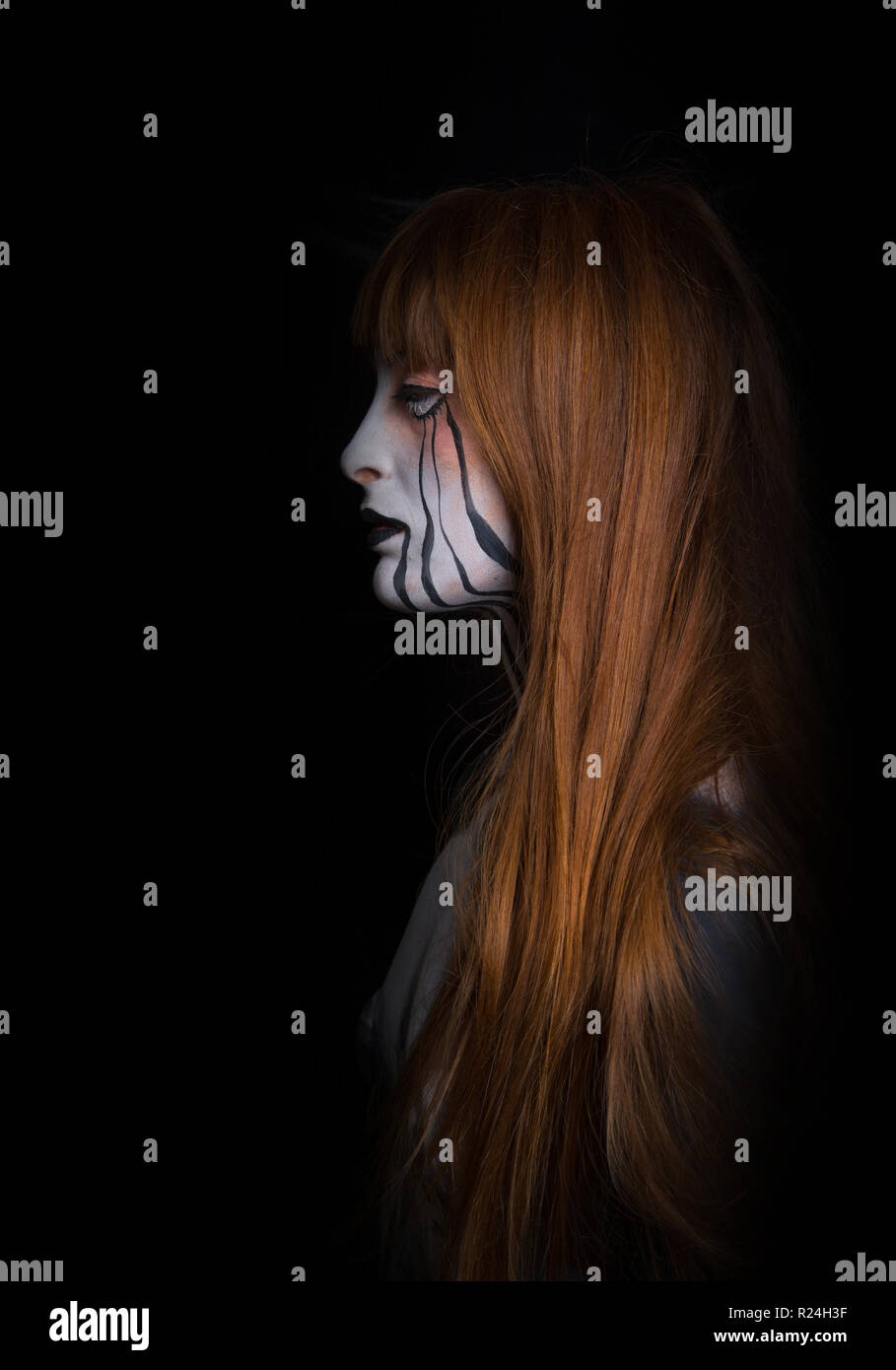 masked girl made up for halloween horror Stock Photo - Alamy