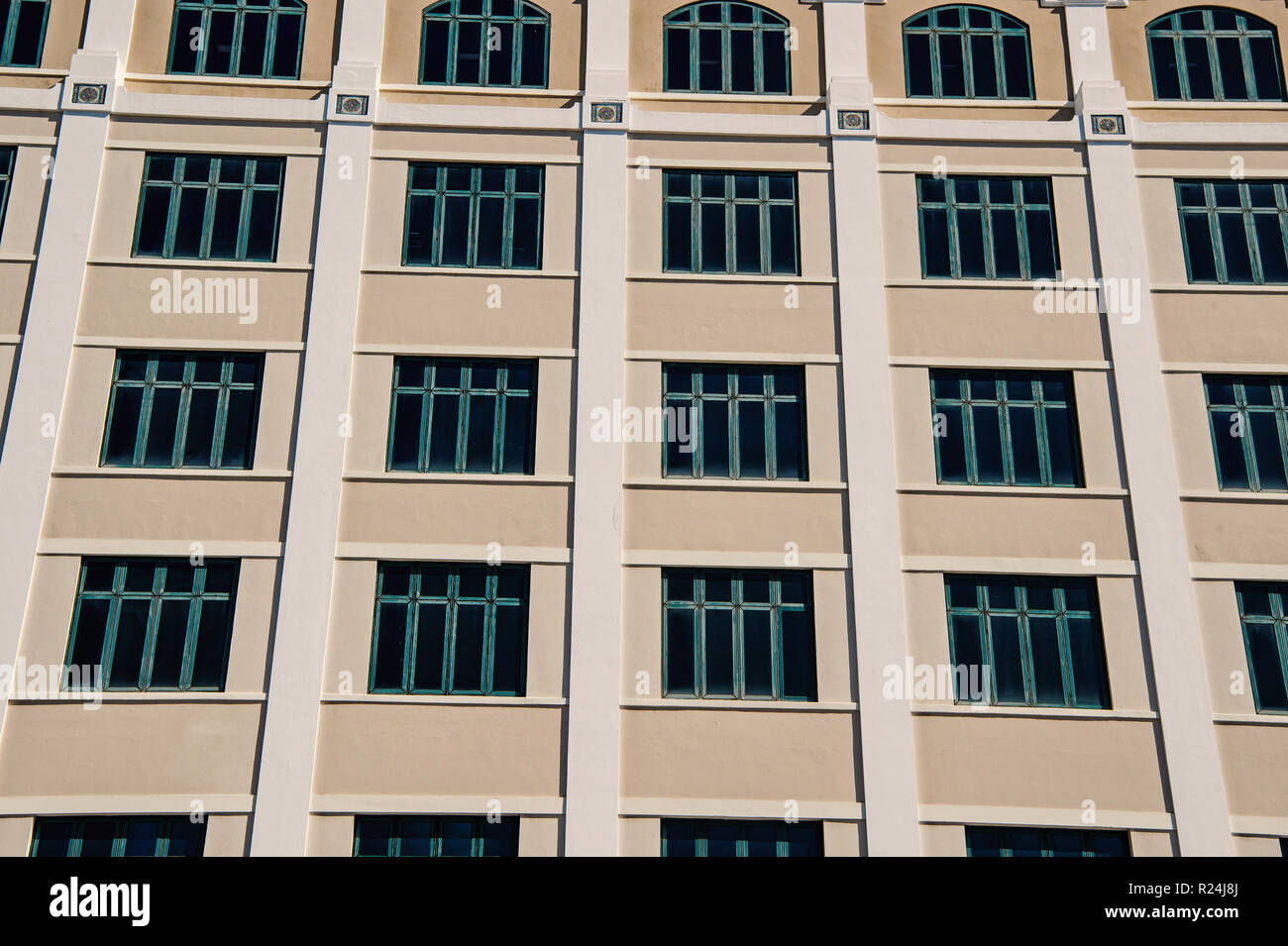 Windows on beige wall background in San Juan, Puerto Rico. House with ...