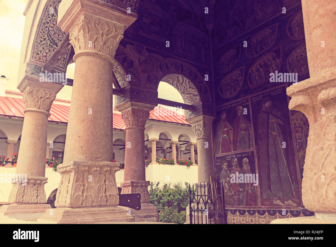Closeup of porch of church at Horezu Monastery with colorful religious ...