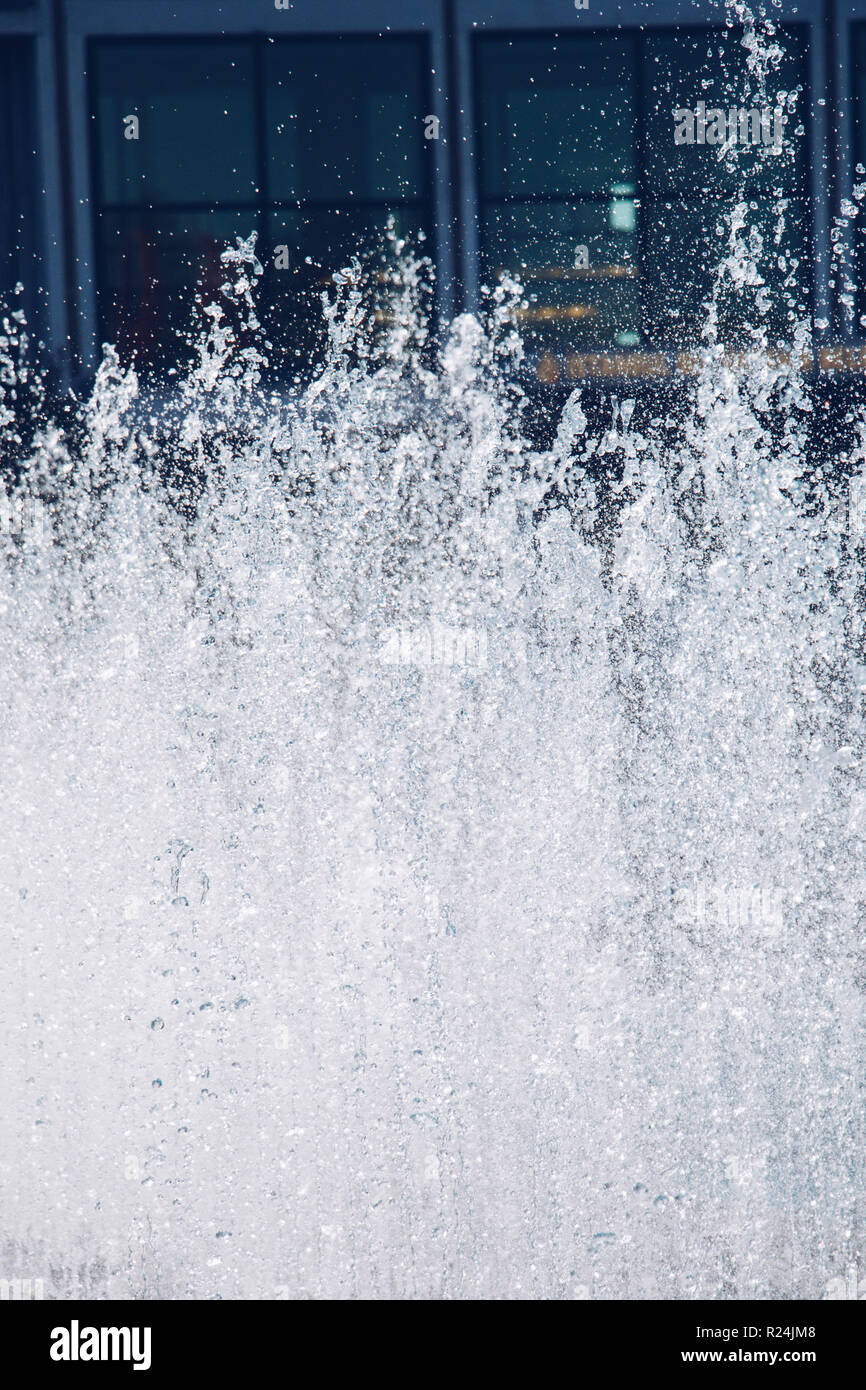 A water fountain sprinkling water in the view Stock Photo - Alamy