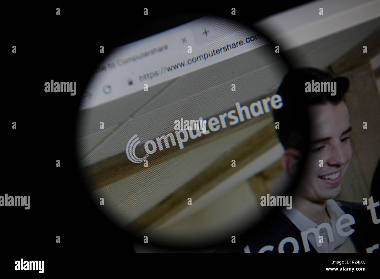 The Computershare website seen through a magnifying glass Stock Photo ...