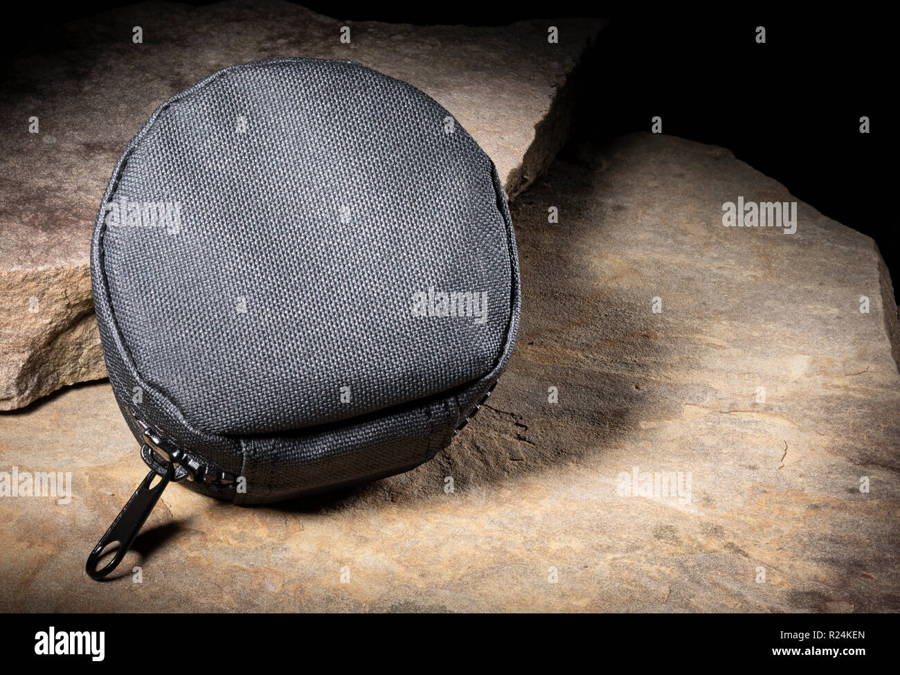 Nylon pouch for tactical gear on a pair of large stones Stock Photo - Alamy