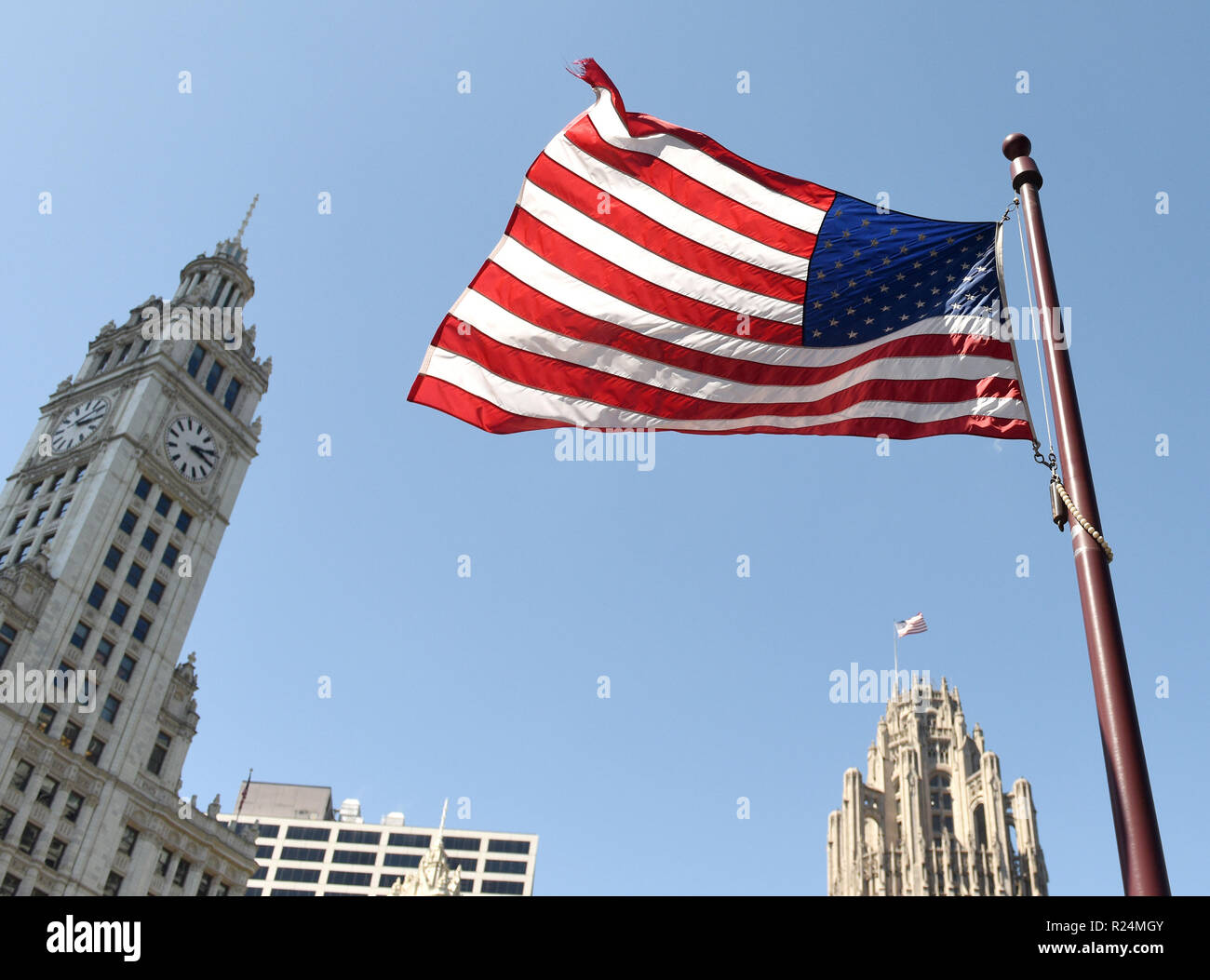 American flag waving in downtown of Chicago, USA Stock Photo - Alamy
