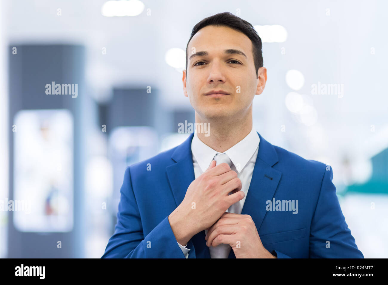 Young businessman adjusting look hi-res stock photography and images ...