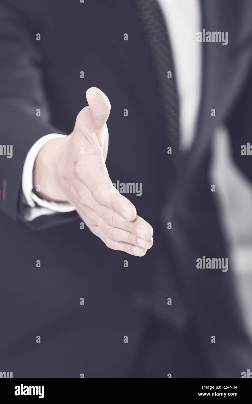 Businessmen ready to handshake offering successful business partnership ...