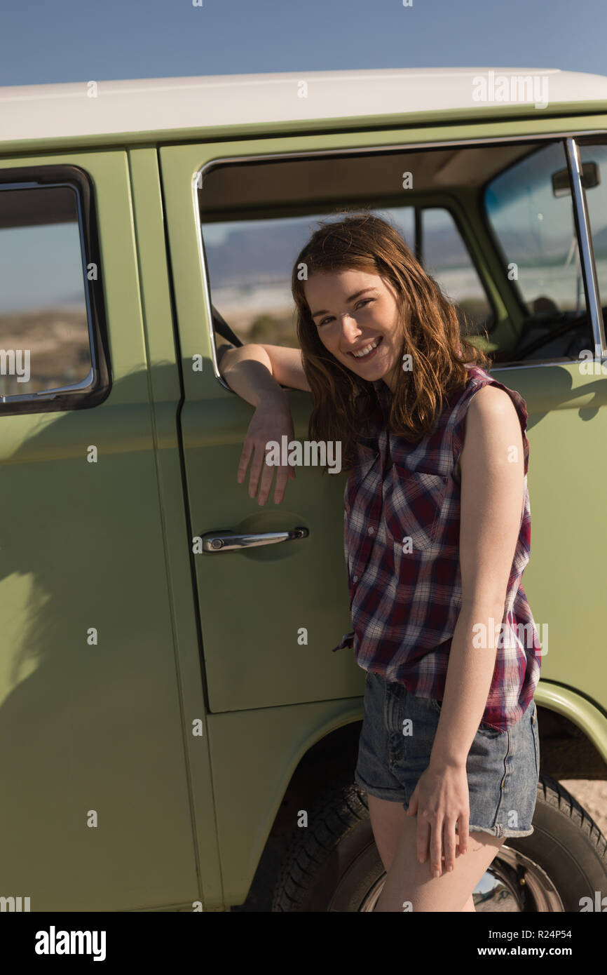 Woman leaning on van Stock Photo - Alamy
