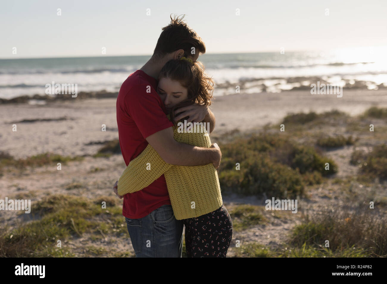 Couple Standing Cuddling Beach High Resolution Stock Photography and ...