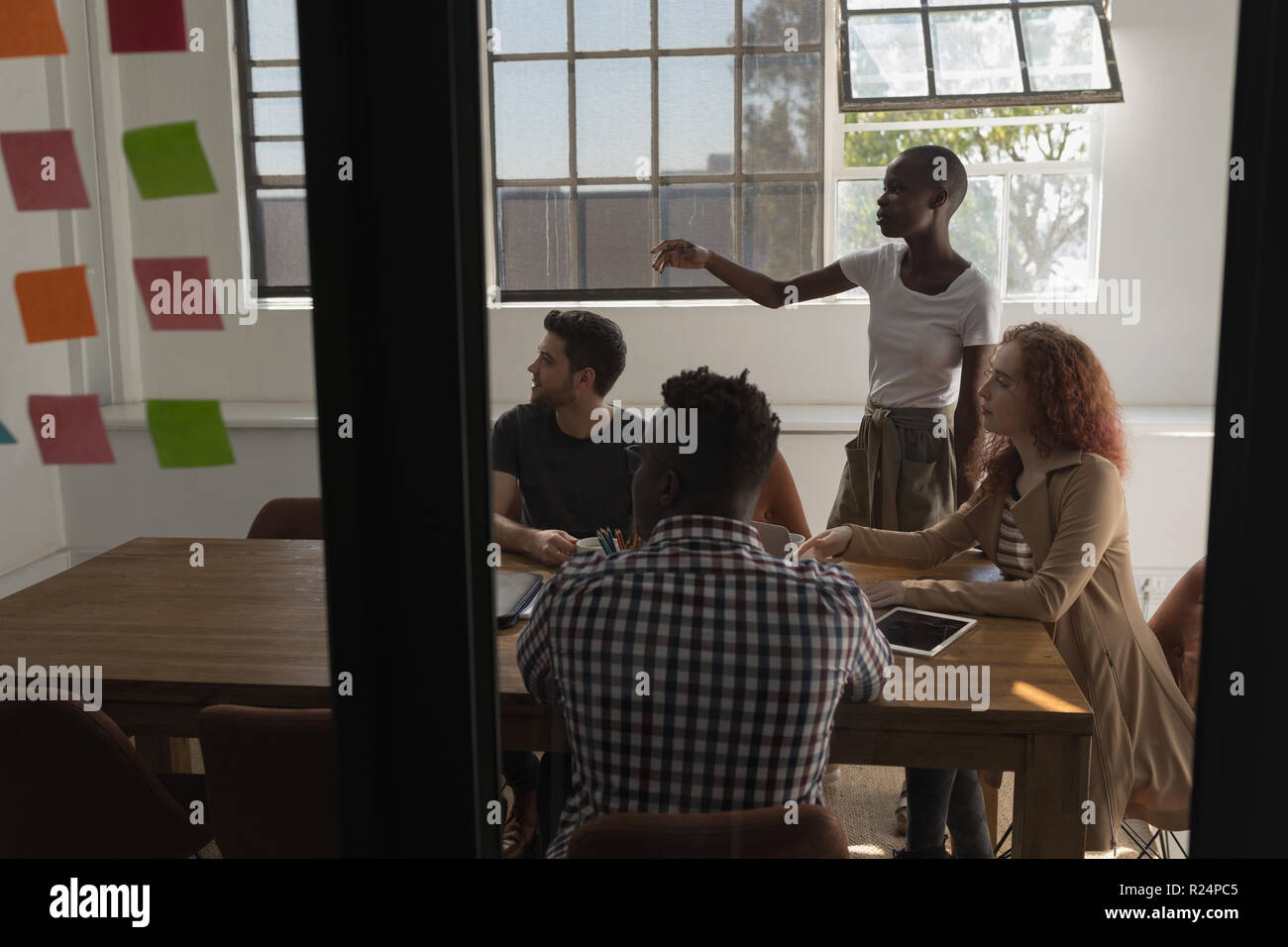 Executives discussing in conference room Stock Photo - Alamy