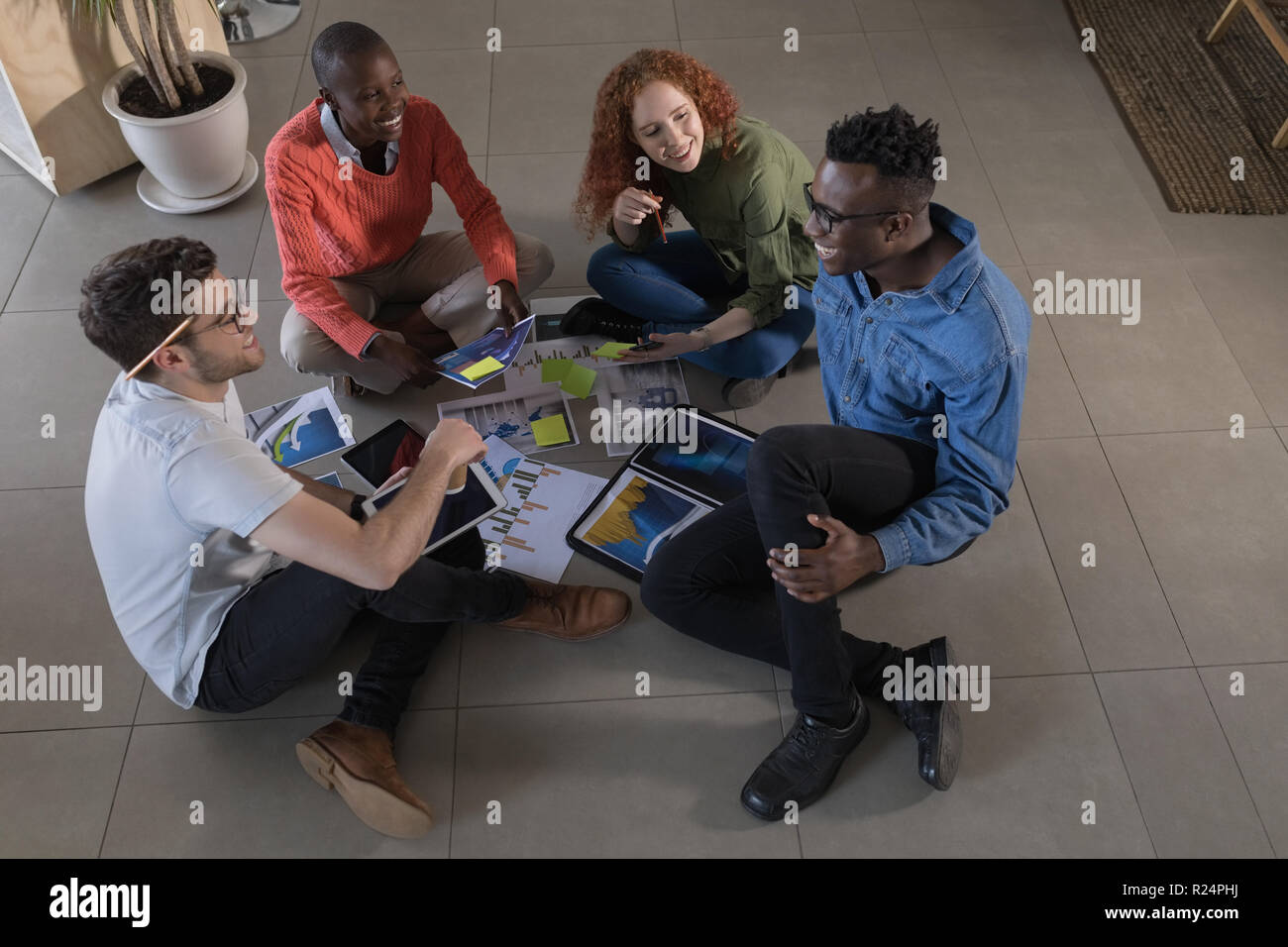 Executives talking with each other in office Stock Photo - Alamy