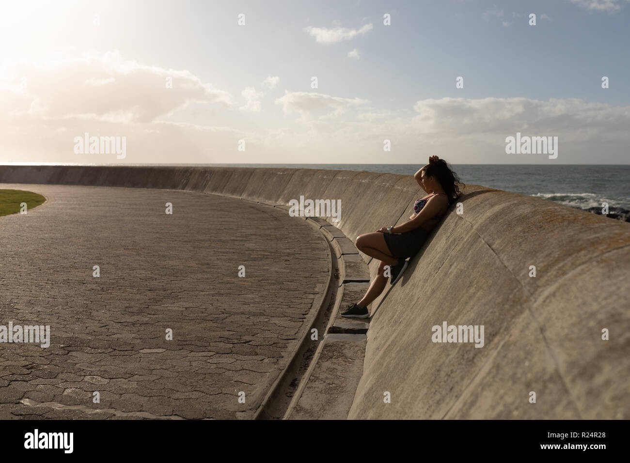 Female leaning against wall hi-res stock photography and images - Alamy