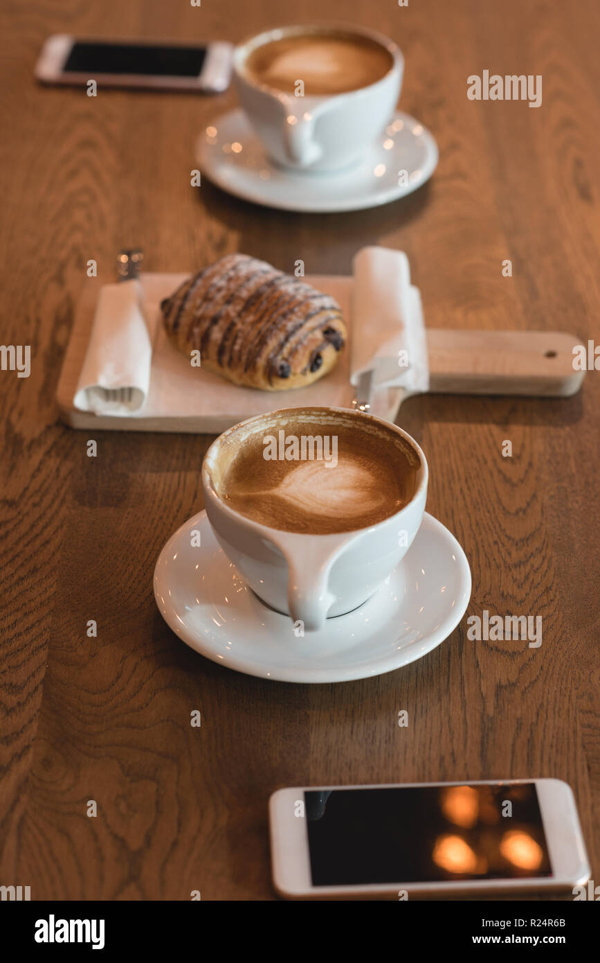 Coffee and sweet food on table in cafe Stock Photo - Alamy