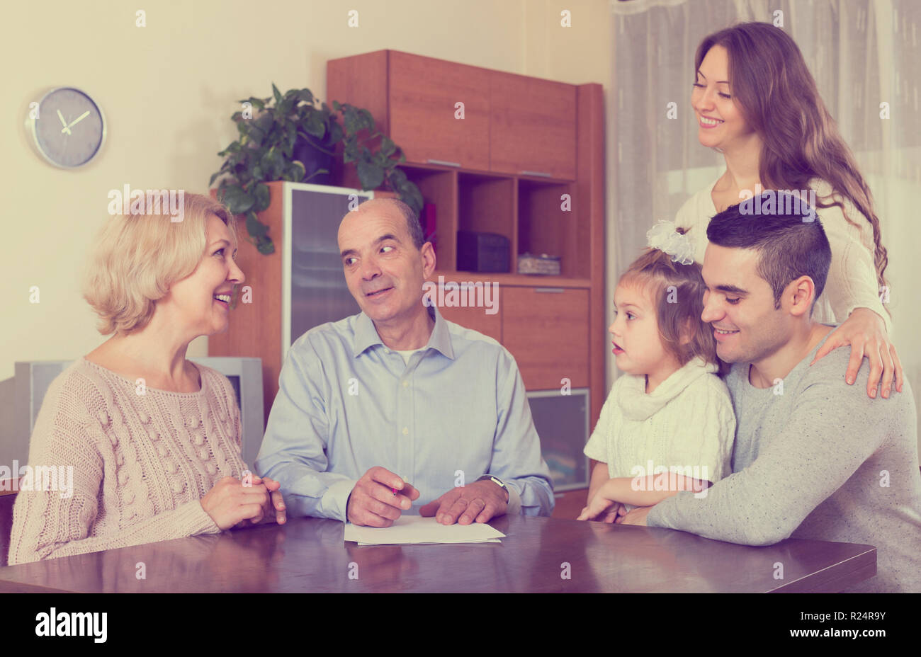 Big family making shopping list together indoor Stock Photo - Alamy
