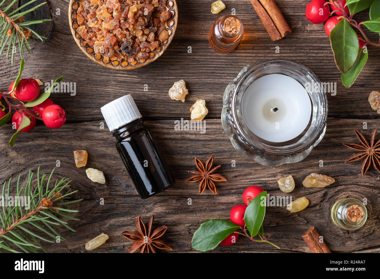 Bottles of essential oil on a Christmas background with frankincense ...