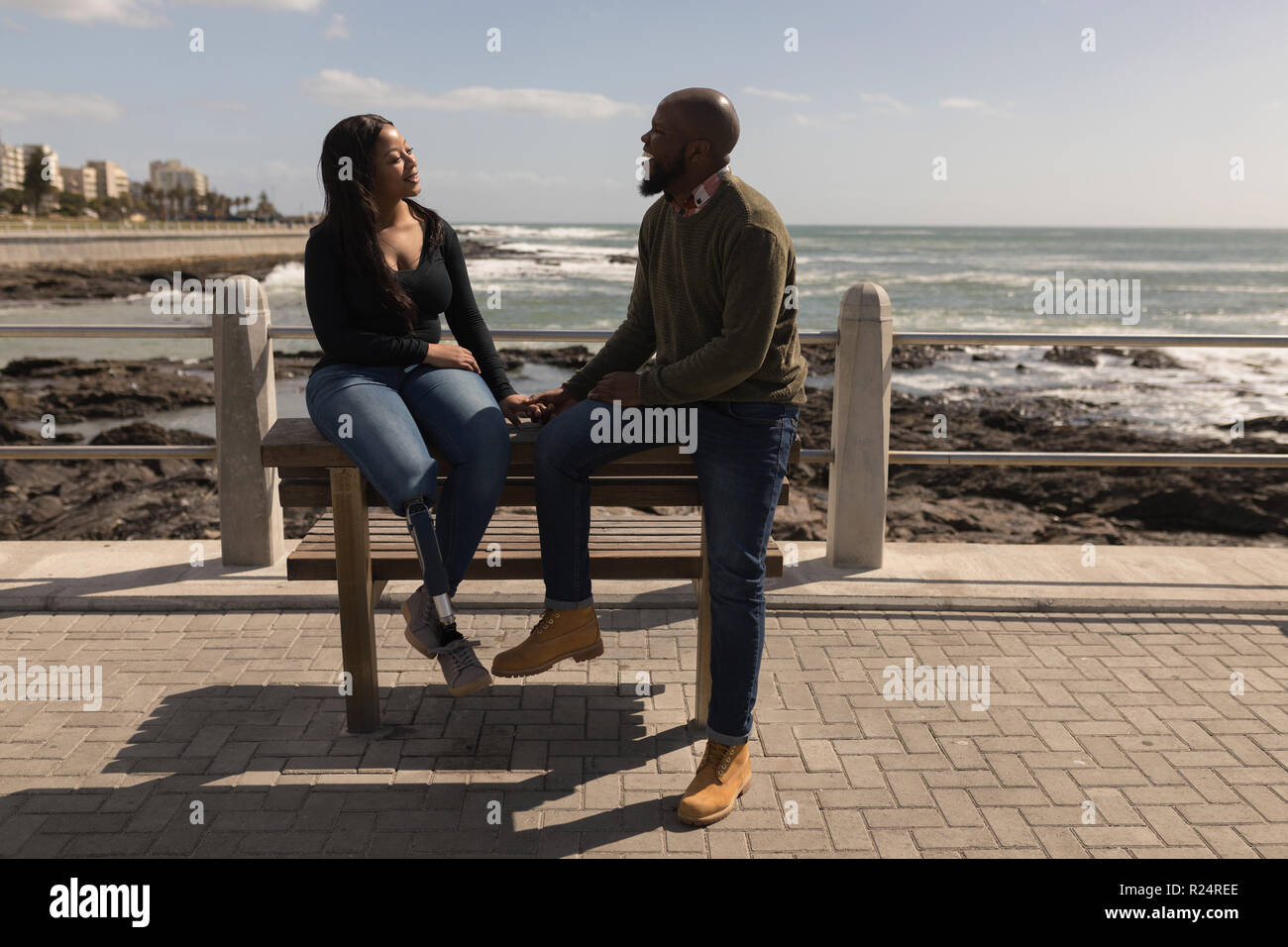 Couple interacting with each other on promenade Stock Photo - Alamy