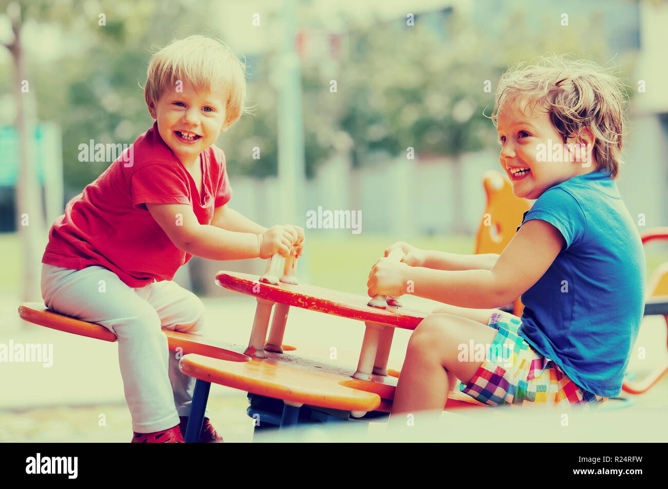 Happy excited children having fun at playground in sunny day Stock ...