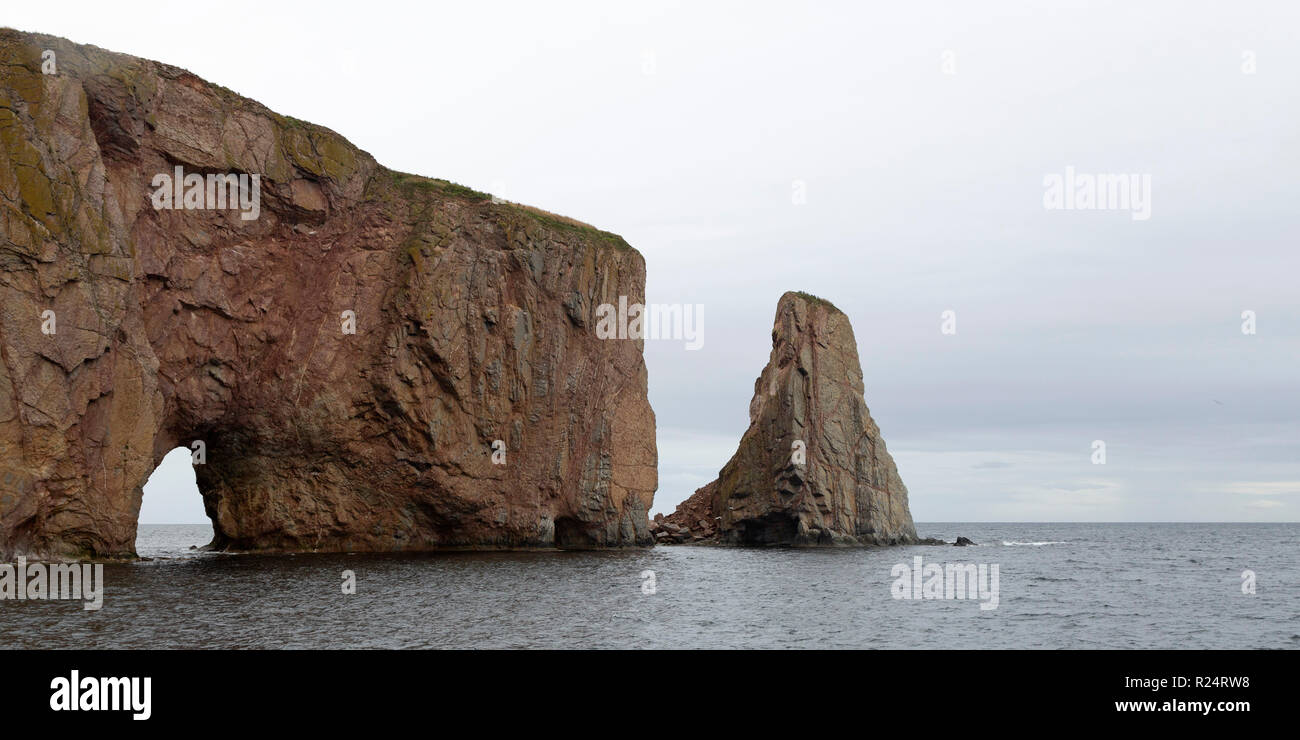 Arch in Perce Rock off the Gaspe Peninsula of Quebec, Canada. The arch ...