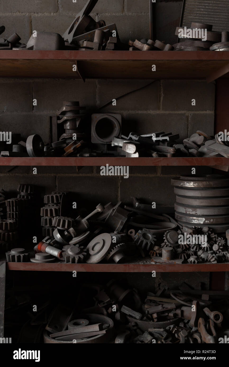 Unfinished metal castings arranged in rack Stock Photo - Alamy