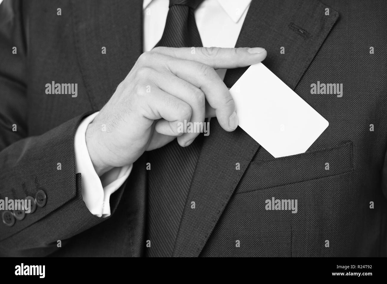 Custom debit card design. Male hand put plastic blank white card to ...