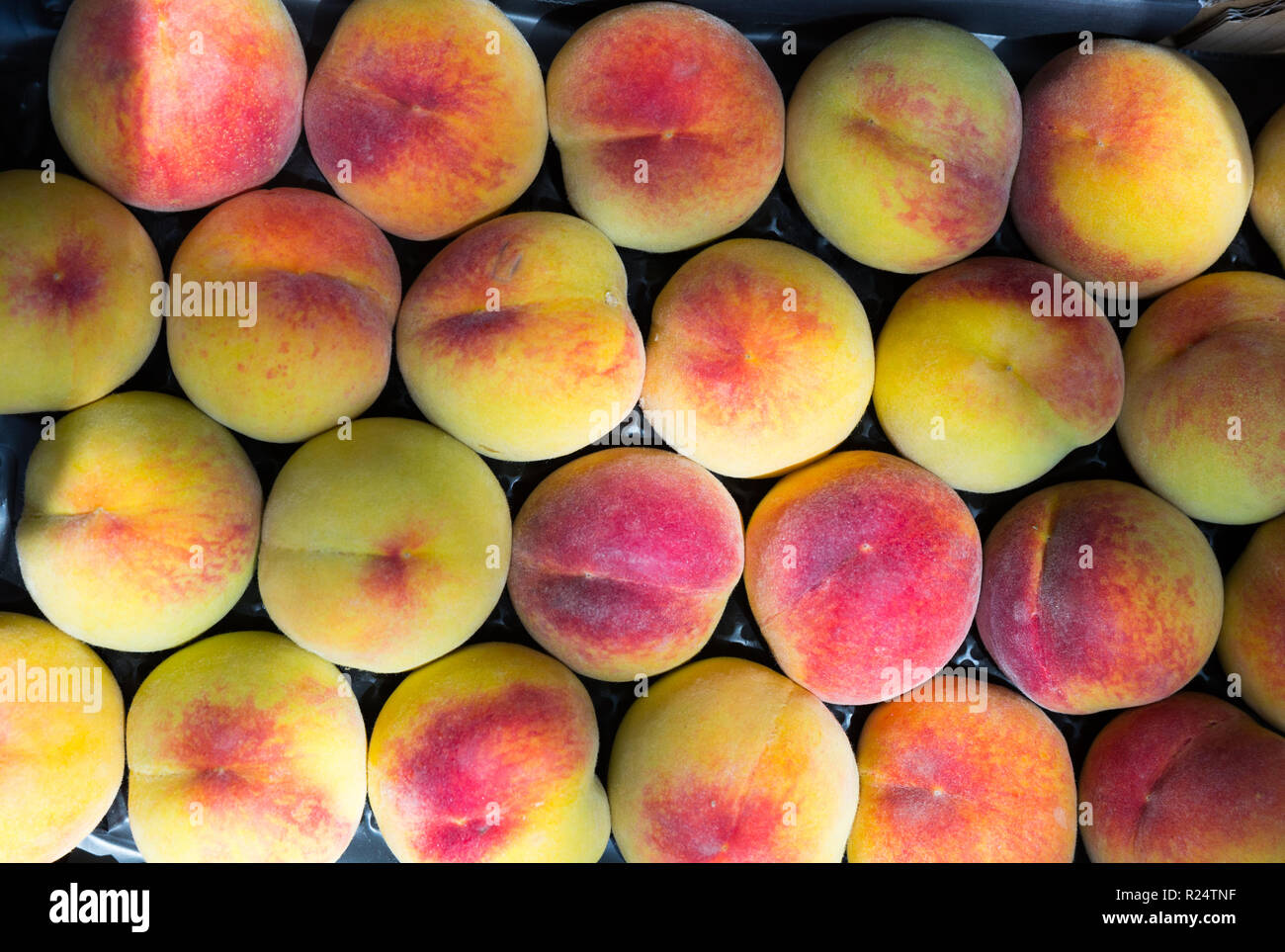 Image of peaches in boxes outdoor Stock Photo - Alamy