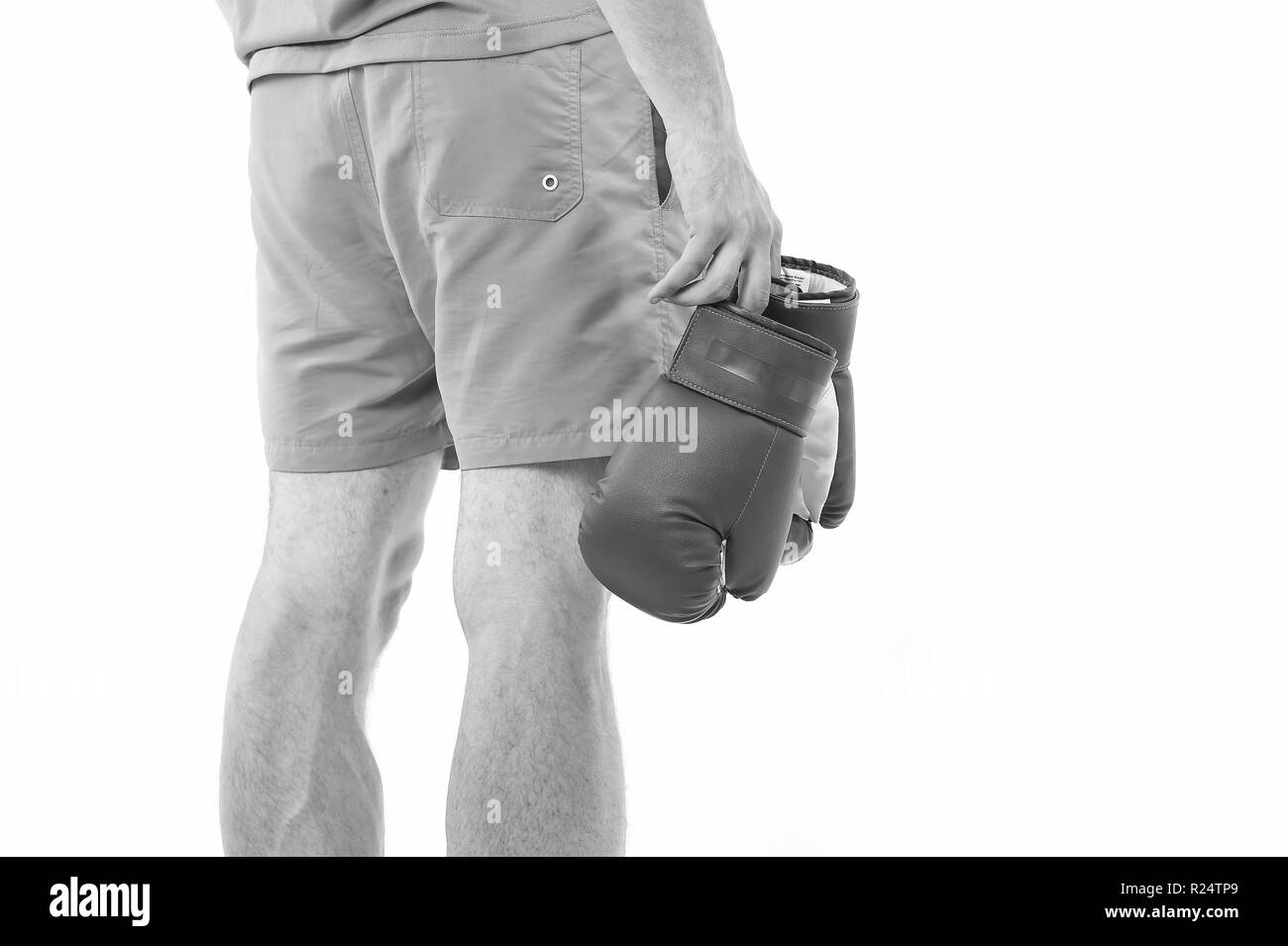 Man in shorts carries boxing gloves rear view isolated white background ...