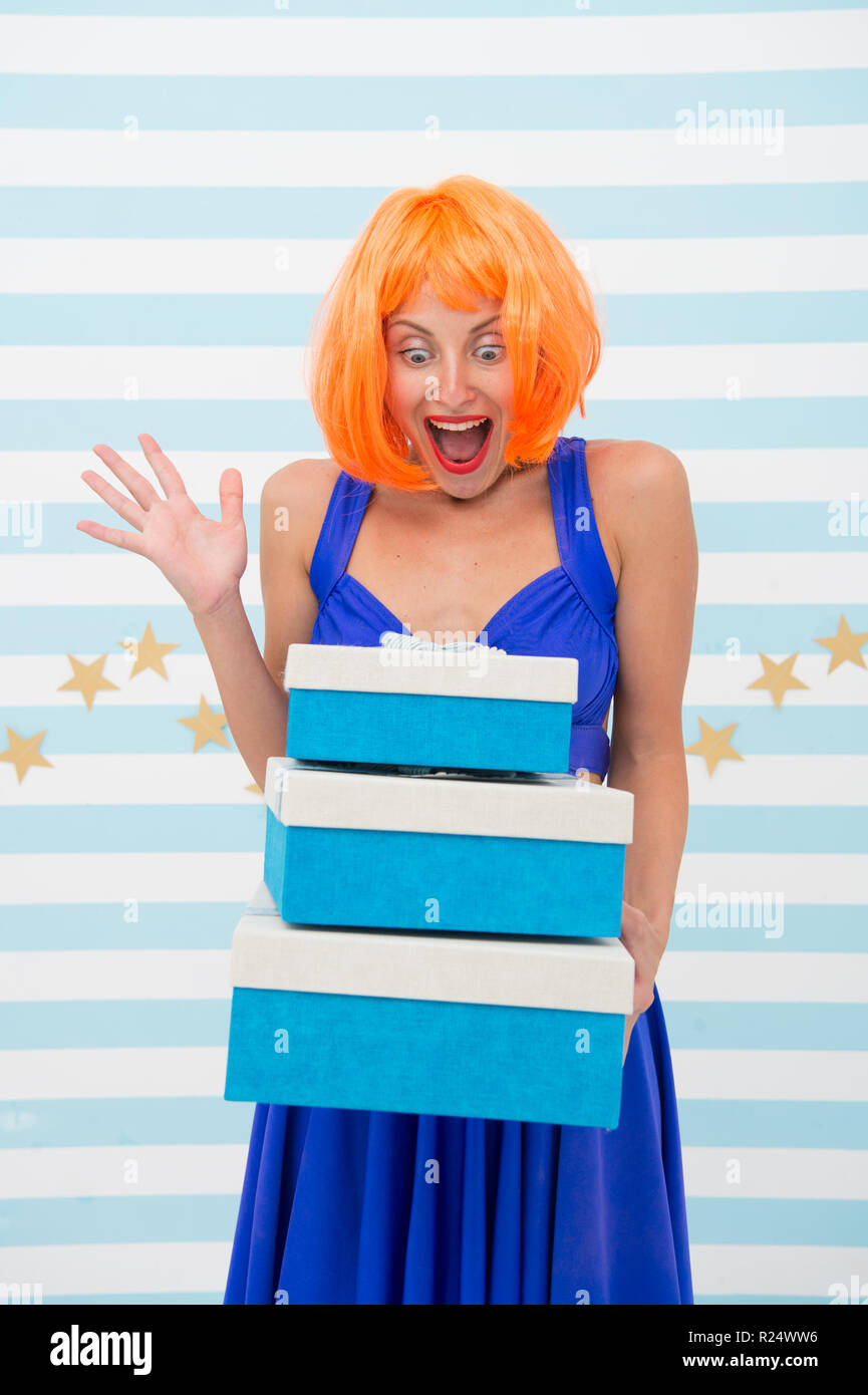 Crazy girl with present boxes. Happy girl chooses which box to open ...