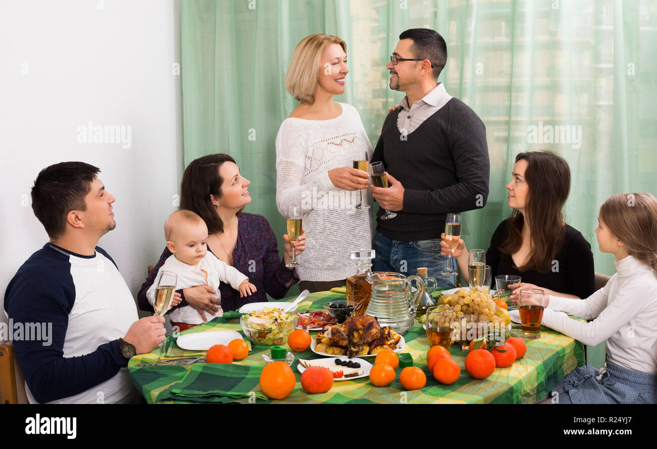 Portrait of relatives celebrating big family event in home Stock Photo ...