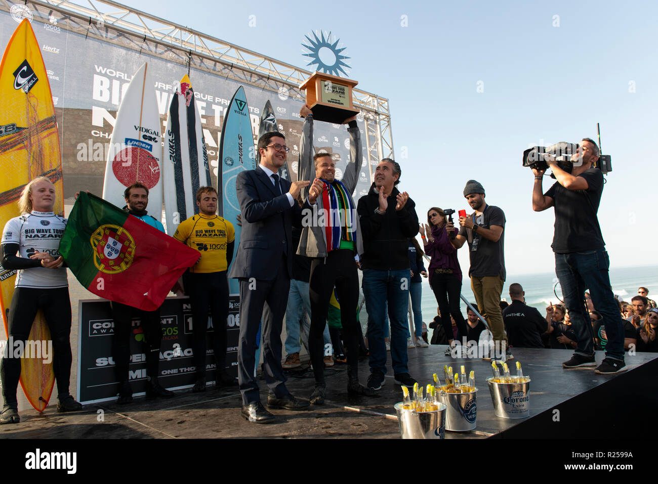 Big wave surfer Grant Baker (ZAF) is seen receiving the first winner ...