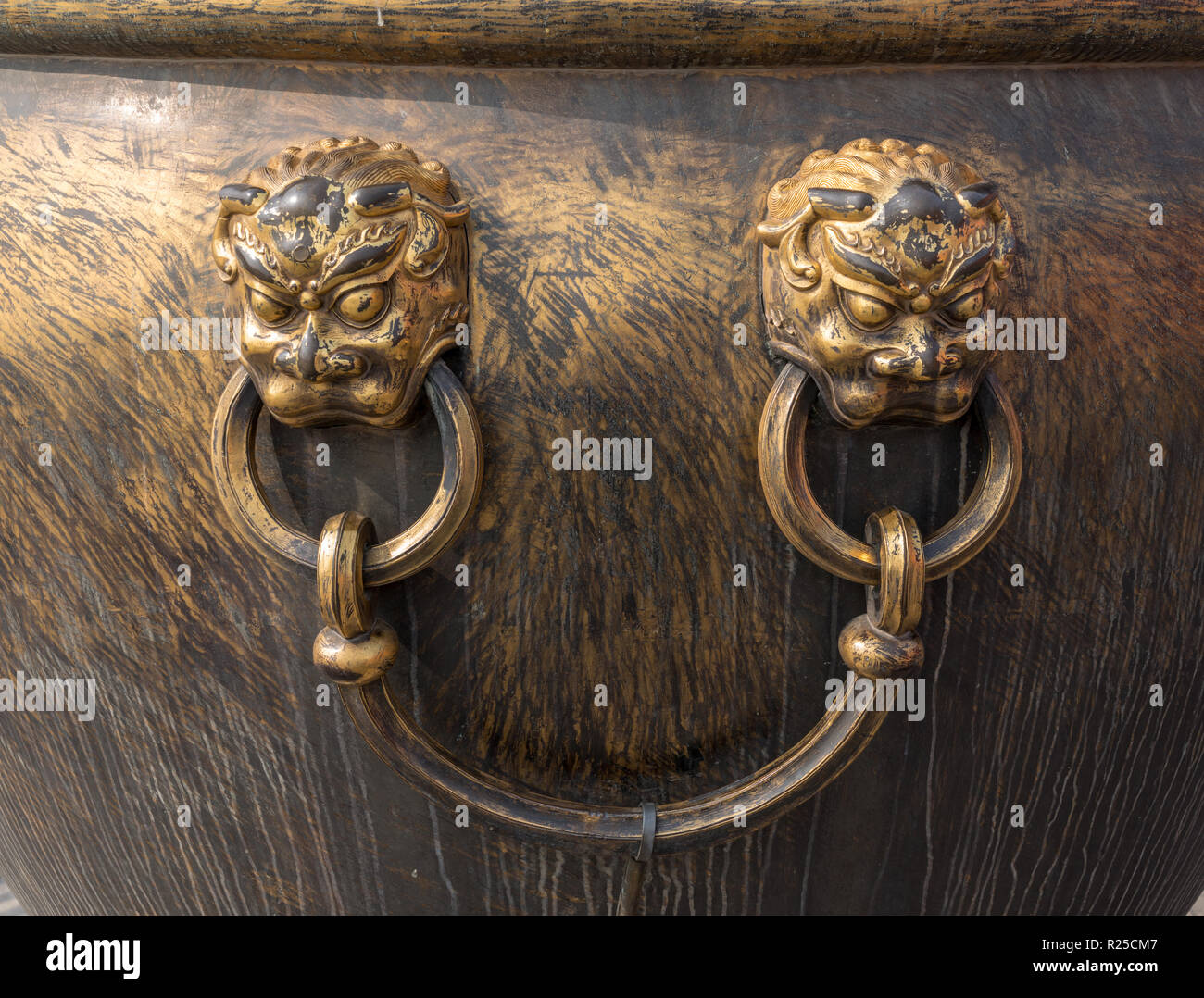 Lion handle on urn in Forbidden City in Beijing Stock Photo - Alamy