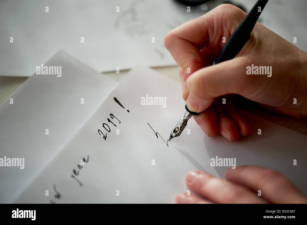A woman's hand writes with ink, a fountain pen. Writing. The creative ...