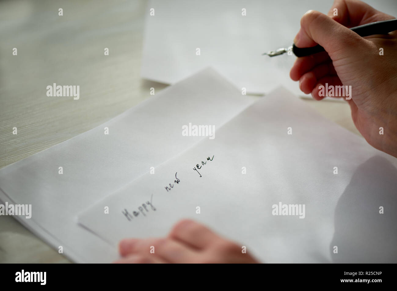 A woman's hand writes with ink, a fountain pen. Writing. The creative ...