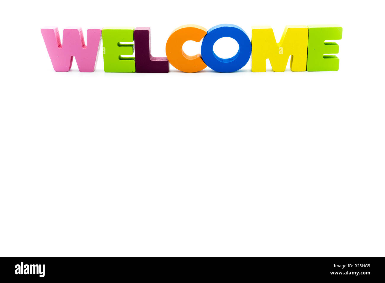 Word WELCOME written with colourful wooden letters, isolated over white ...