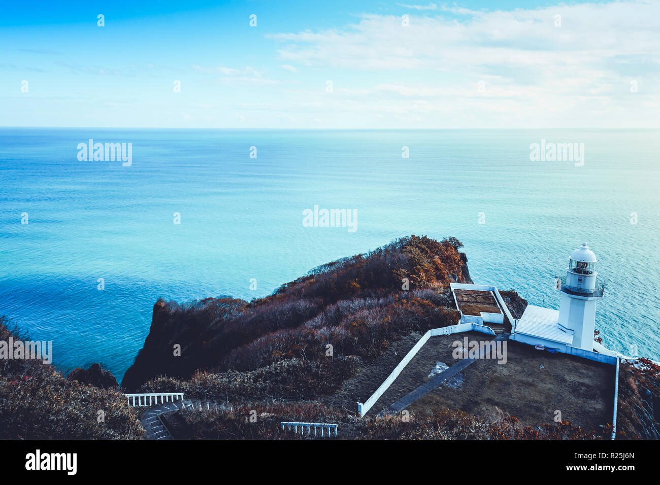 Lighthouse and ocean with blue sky at cape Chikyu Hokkaido Japan Stock ...