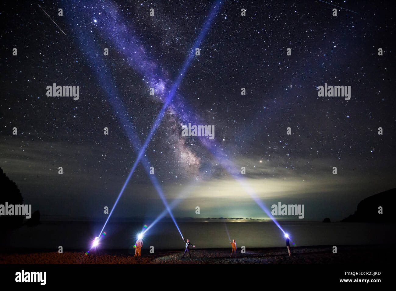 People shine with led flashlights to night sly with milky way Stock ...