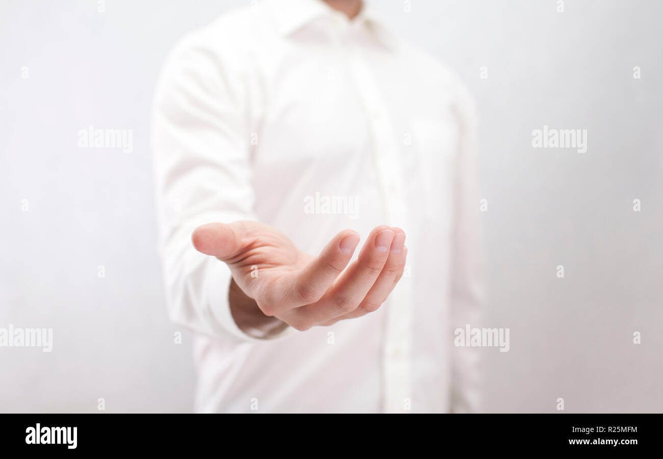 Man with open hand. Holding, giving, showing concept Stock Photo - Alamy
