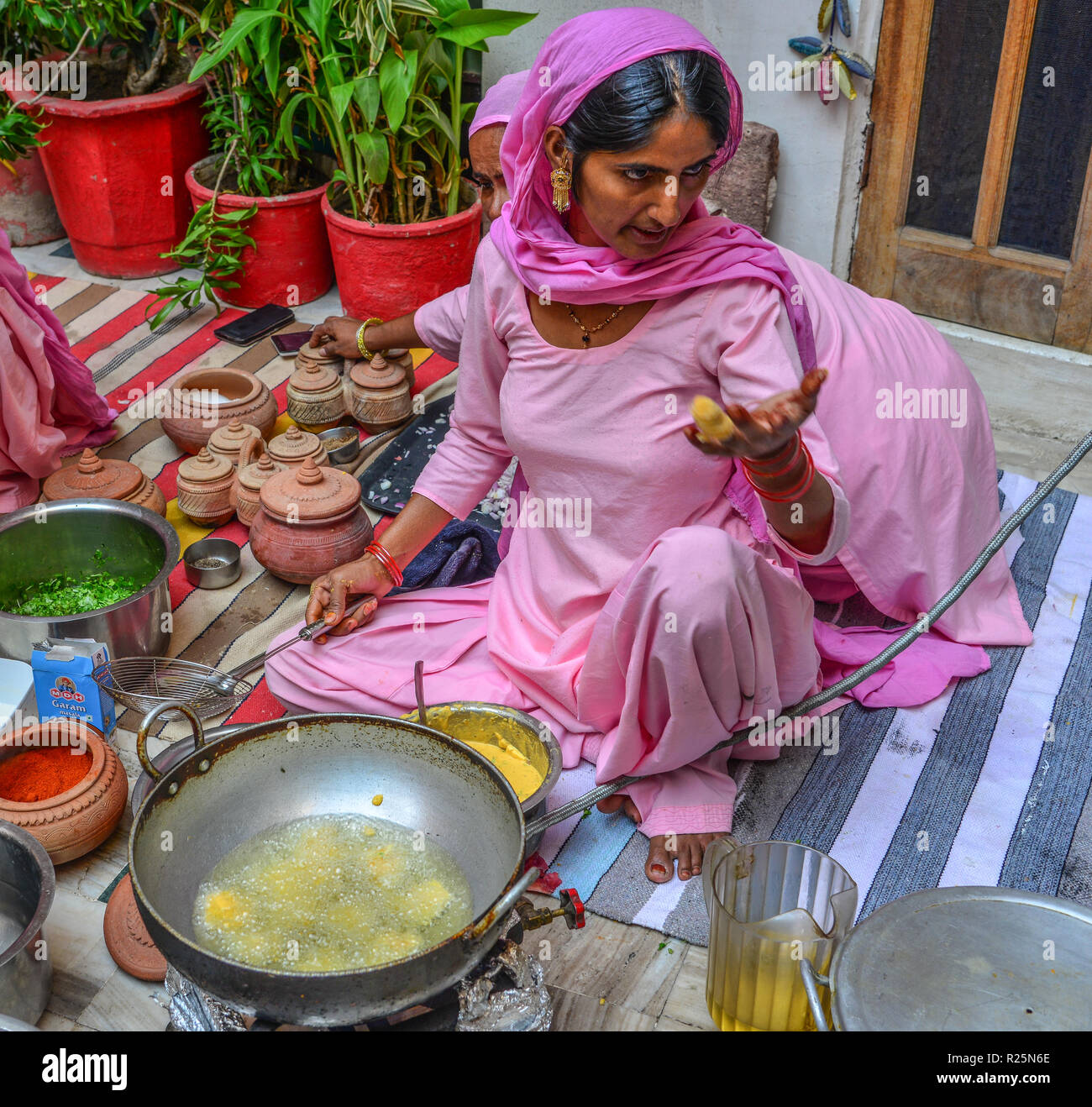 Jodhpur, India - Nov 6, 2017. Women cooking Indian traditional meal in ...
