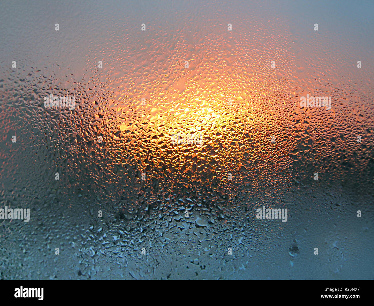 Water drops and sunlight on window glass Stock Photo - Alamy