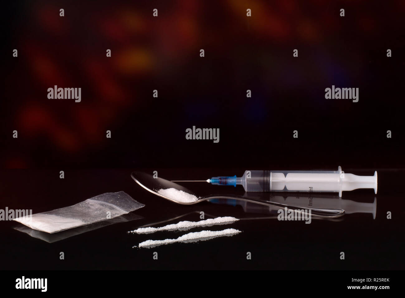 Drug abuse, addiction concept. Lines of white powder, syringe and spoon ...